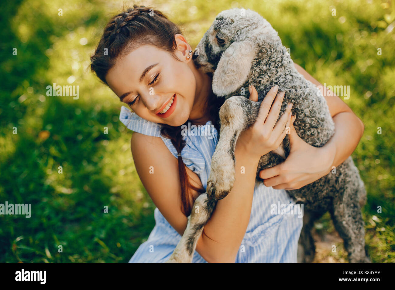 beautiful girl with goat Stock Photo - Alamy