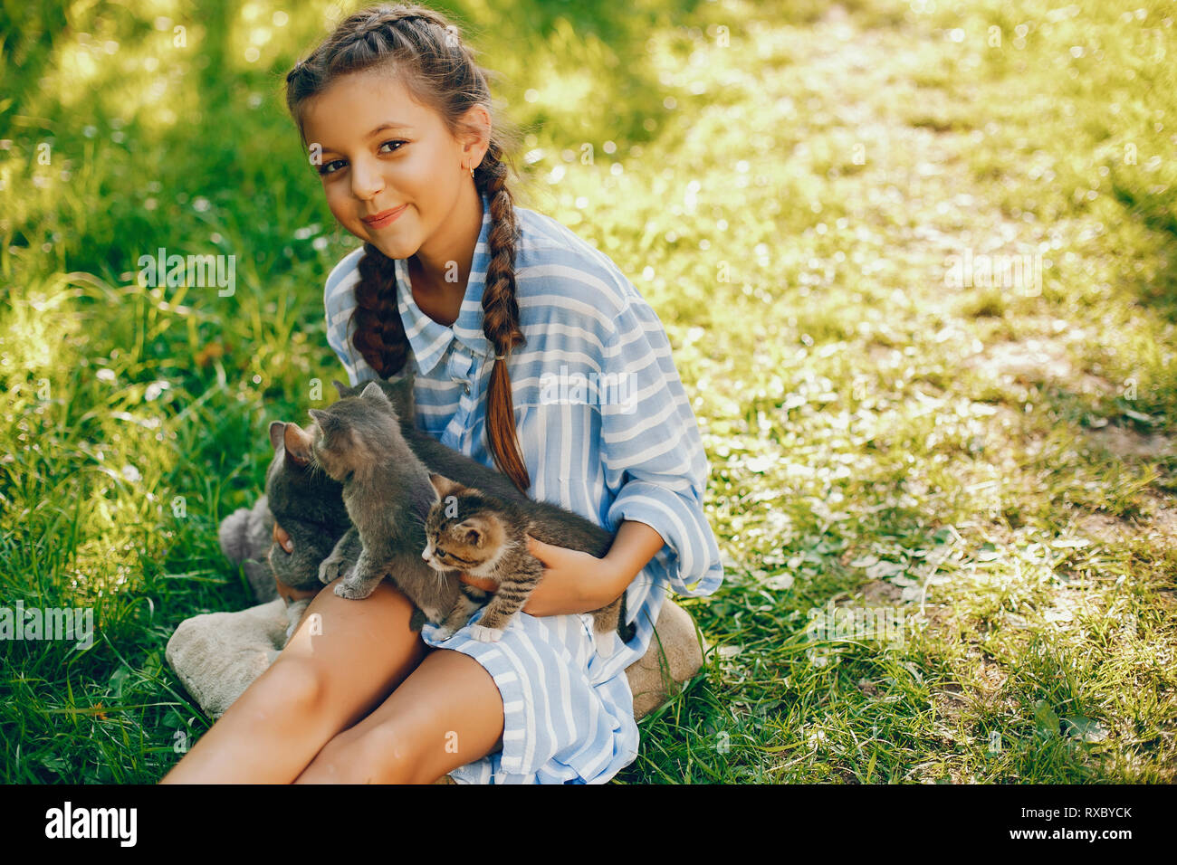beautiful girl with cats Stock Photo - Alamy