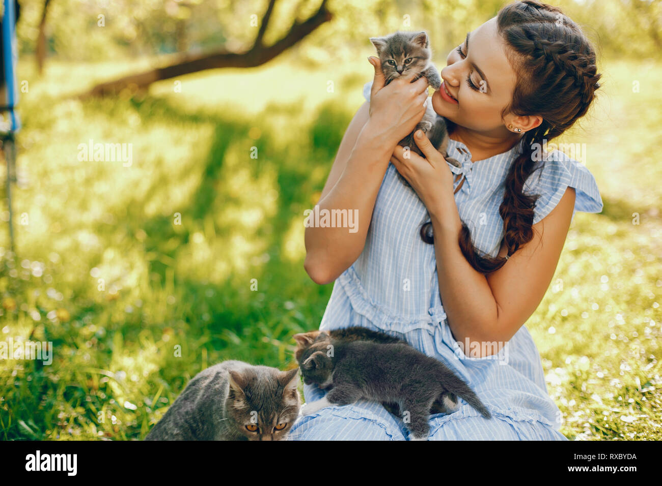 beautiful girl with cats Stock Photo - Alamy
