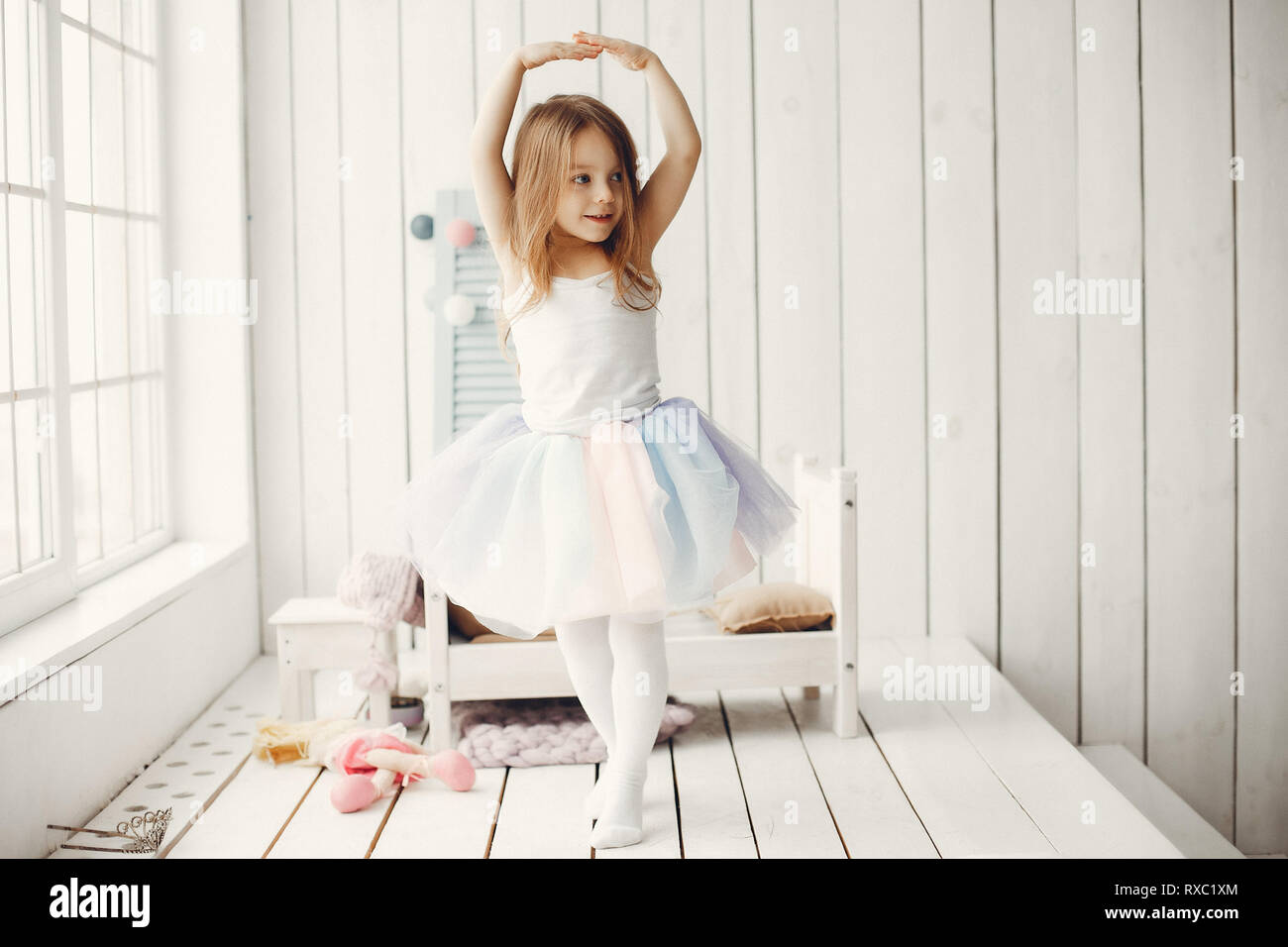 Cute little girl dancing at home Stock Photo - Alamy