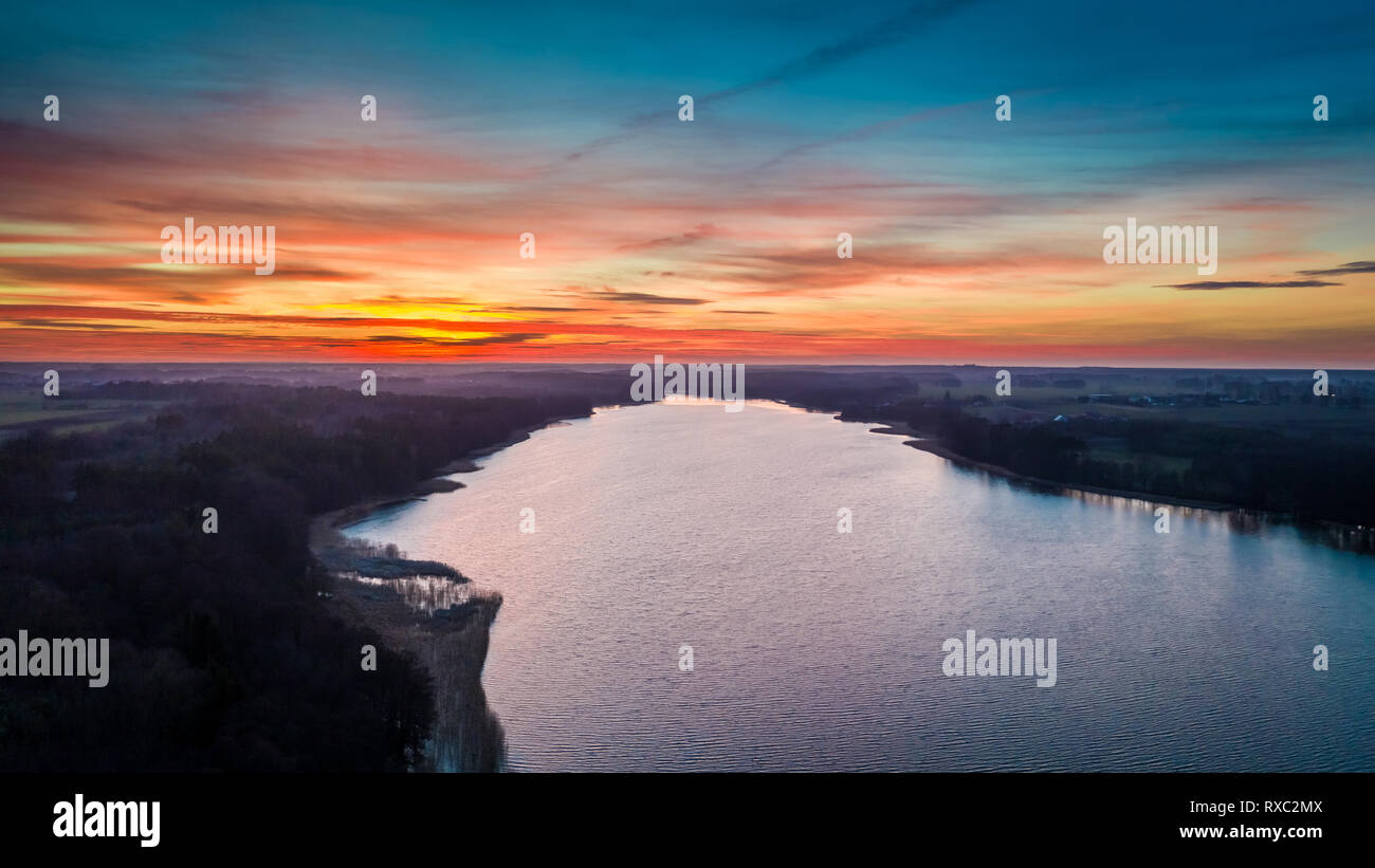 Aerial view of melting ice on lake at dusk Stock Photo - Alamy