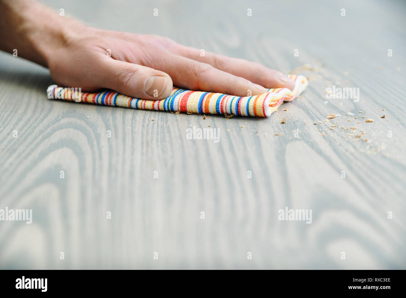 Man's hand with rag wipes the crumbs from the table Stock Photo - Alamy