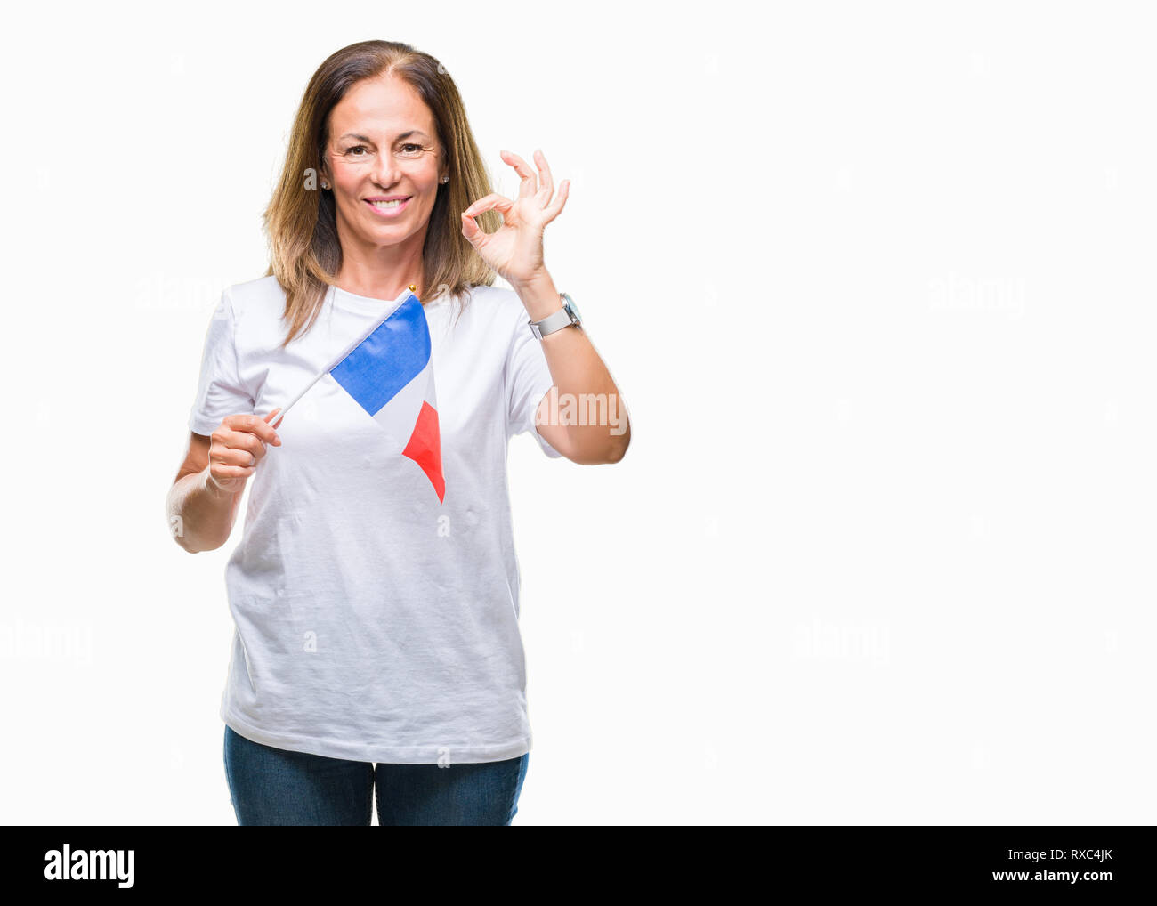 Middle age hispanic woman holding flag of France over isolated ...