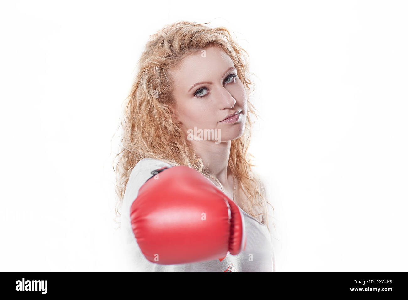 confident young woman in Boxing gloves .isolated on white Stock Photo ...