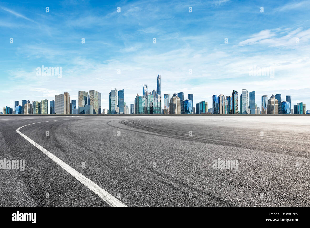 Asphalt road ground and panoramic city skyline with buildings in ...