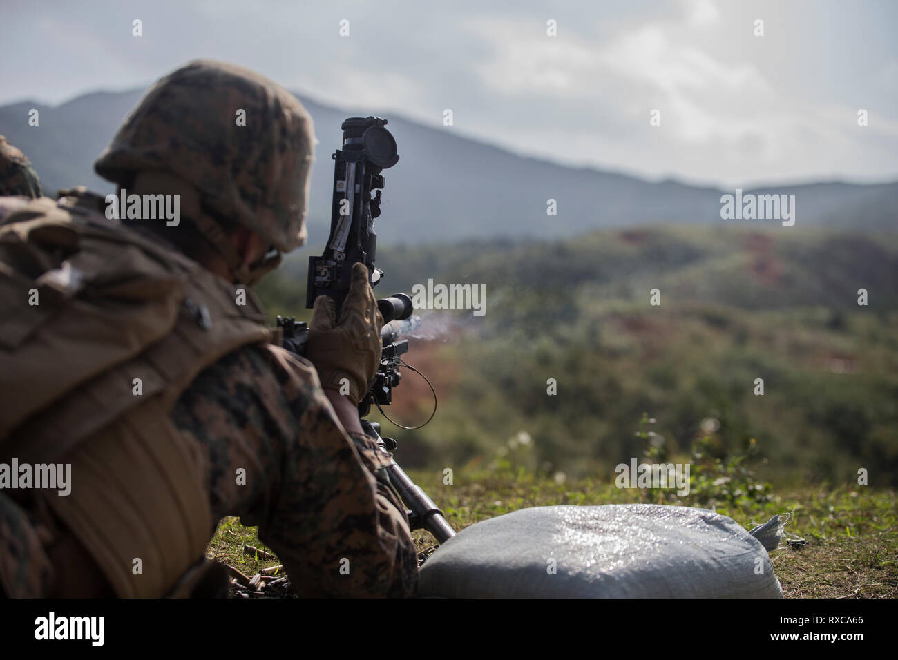 A Marine with Combat Logistics Battalion 31 clears an M249 Squad ...
