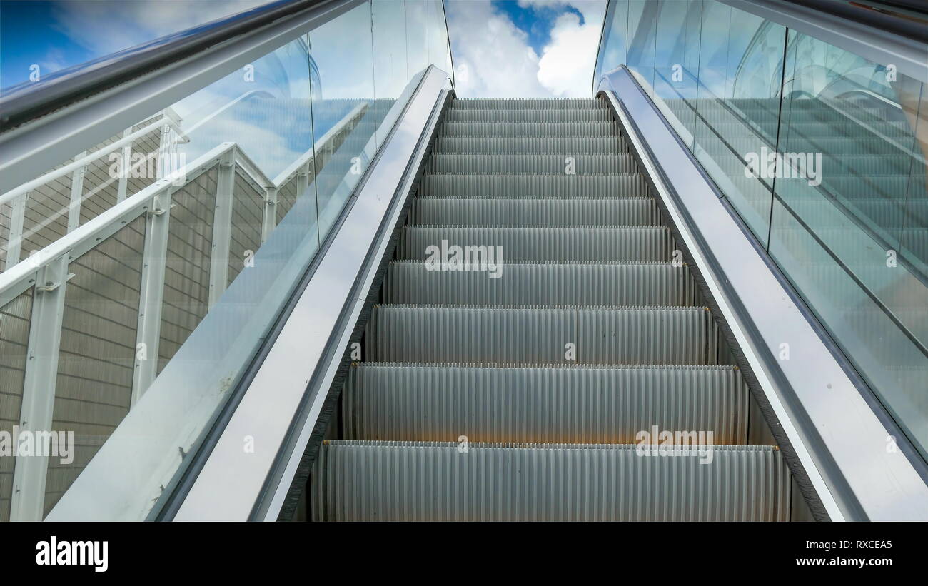 The going up motion of the escalator in a building in the city of Milan ...