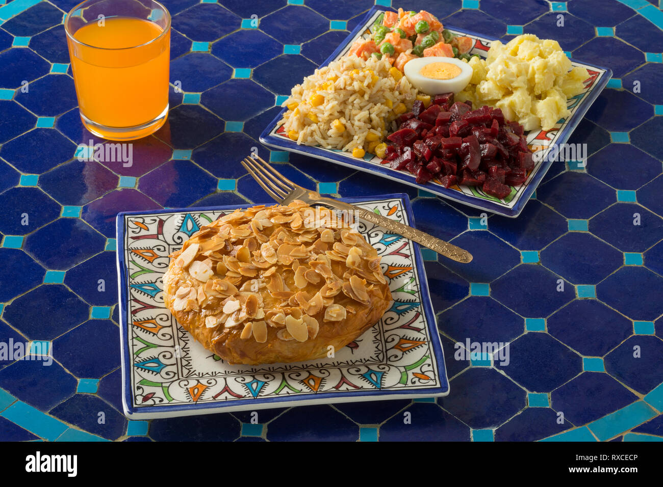 Single fresh baked traditional Moroccan small bastella with roasted ...