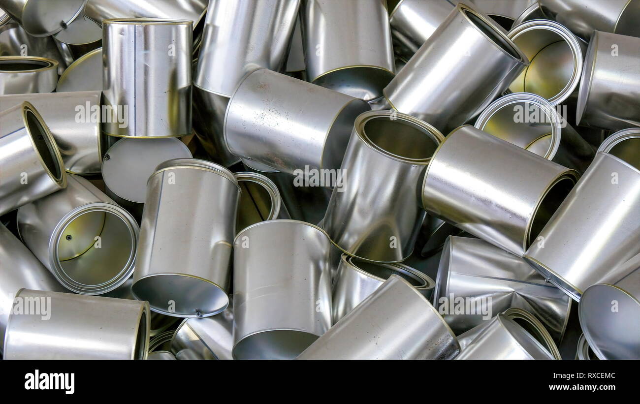 Closer look of the shiny tin cans. Small tin cans in gray color is one ...