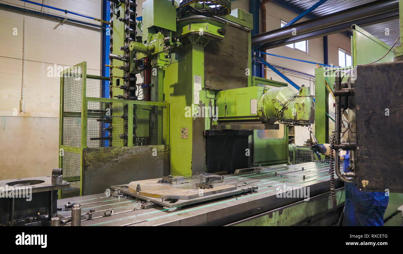 The look inside the steel factory with lots of machines working inside ...