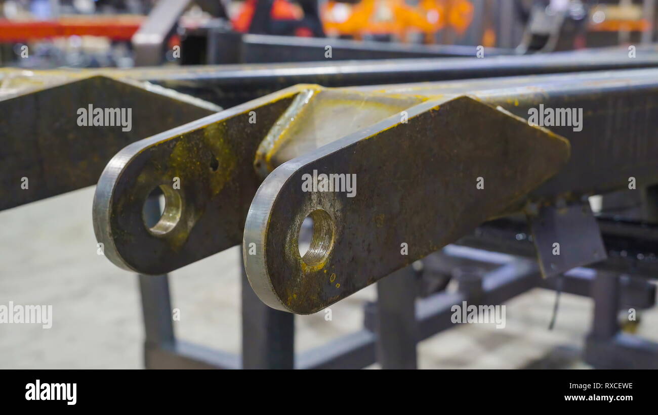 The edge of the steel metal product. It has a hole on the edge to be ...