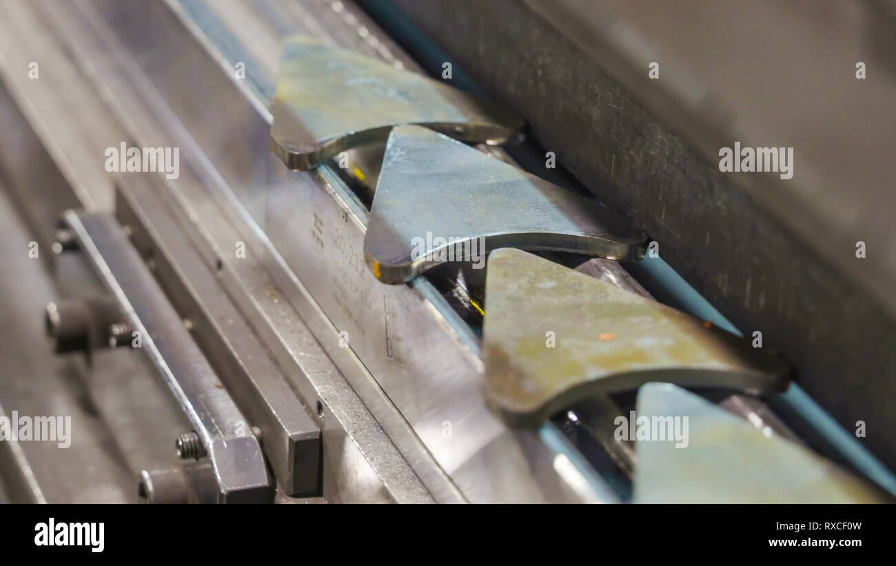 Set of triangular metals being arranged on the machine. These metals ...