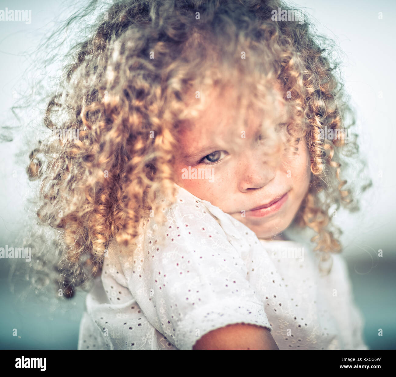 Outdoor portrait of a smiling little girl. Positive emotion concept ...