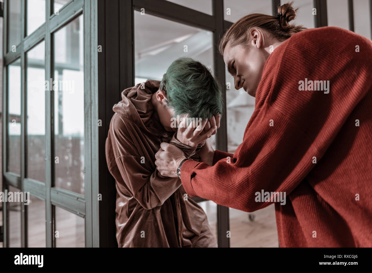 Young girlfriend crying while listening to crazy nervous boyfriend ...