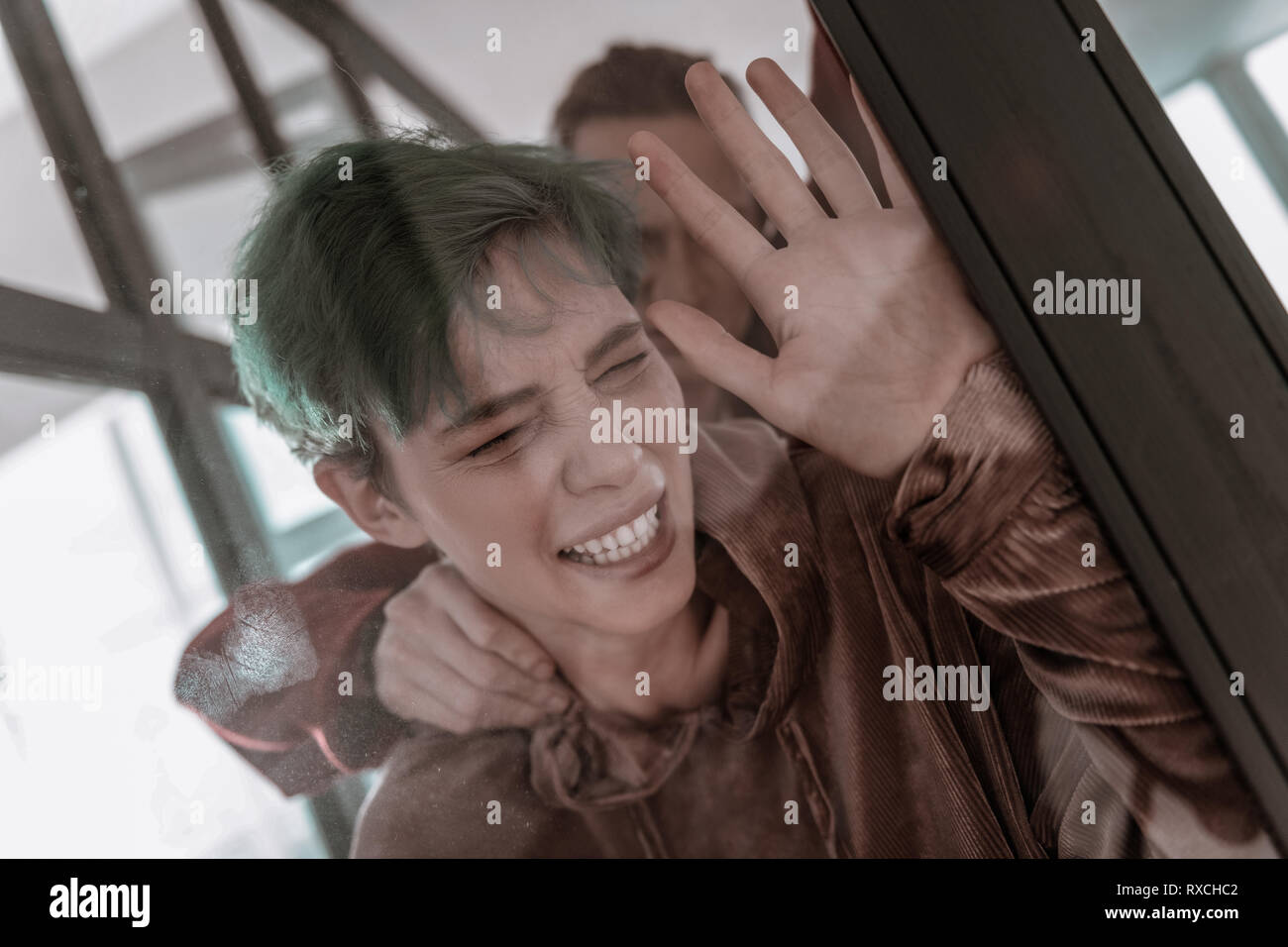 Young woman screaming and crying suffering from beating Stock Photo - Alamy