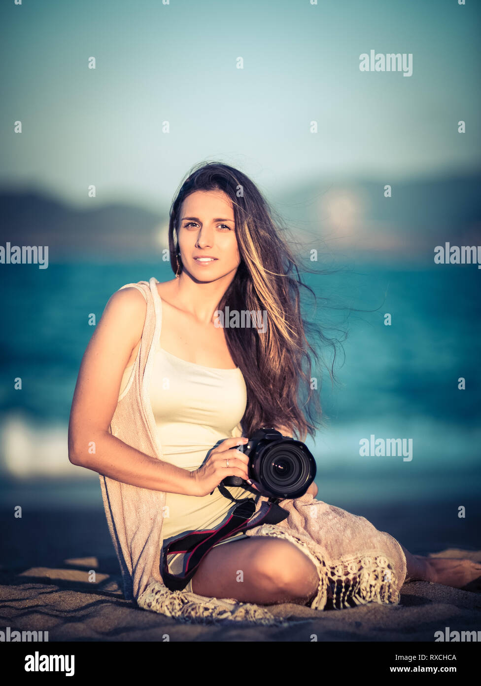 Portrait of a beautiful woman photographer with camera Stock Photo - Alamy