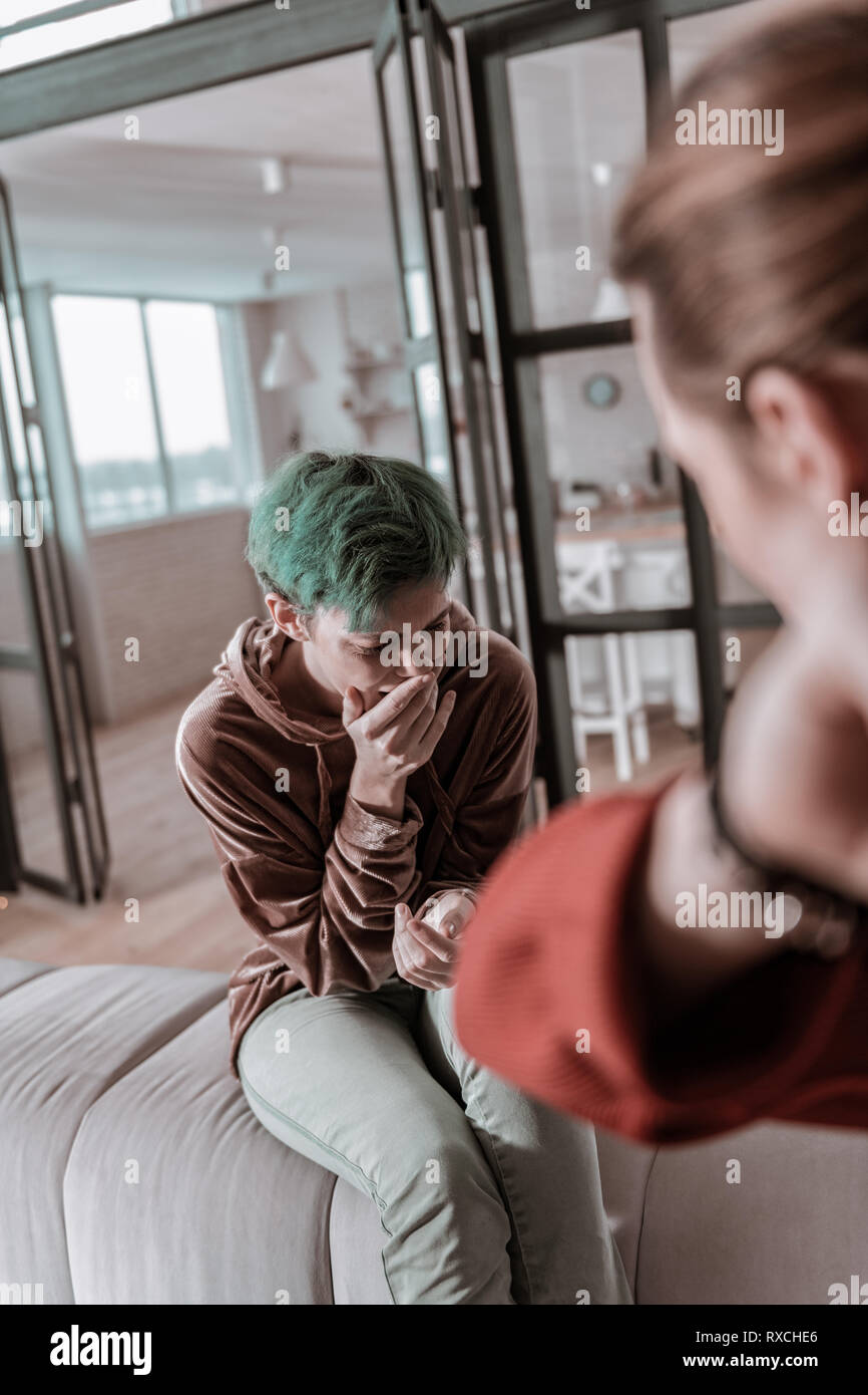 Green-haired wife crying while feeling helpless having crazy man Stock ...
