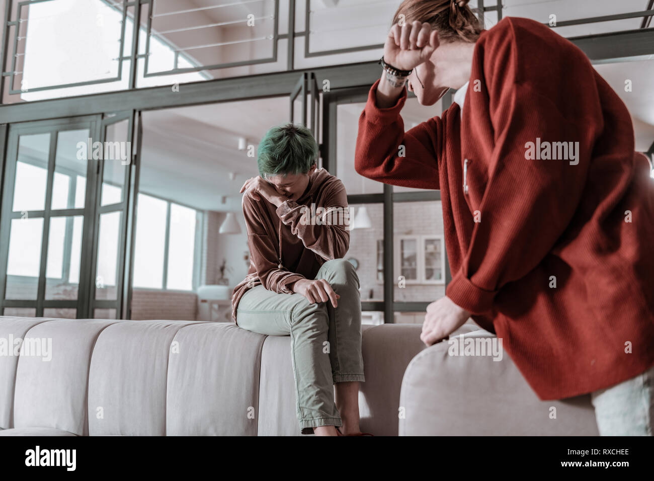 Angry young woman raising hand hi-res stock photography and images - Alamy