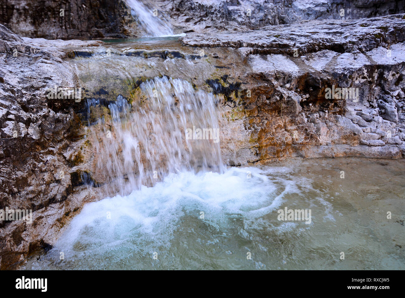 a source of pure and crystalline water that flows from the mountain ...