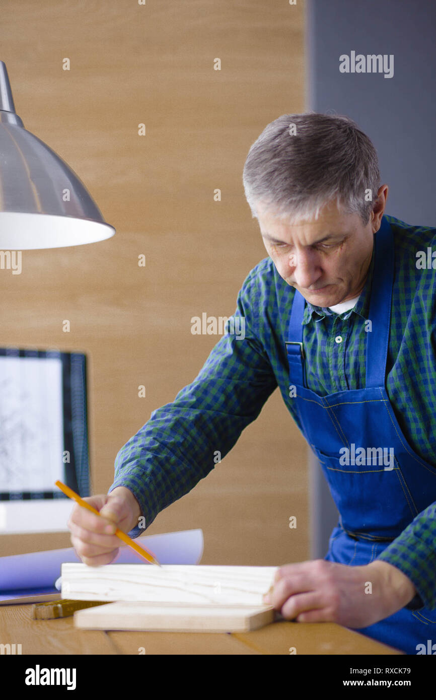 profession, carpentry, woodwork and people concept - carpenter testing ...