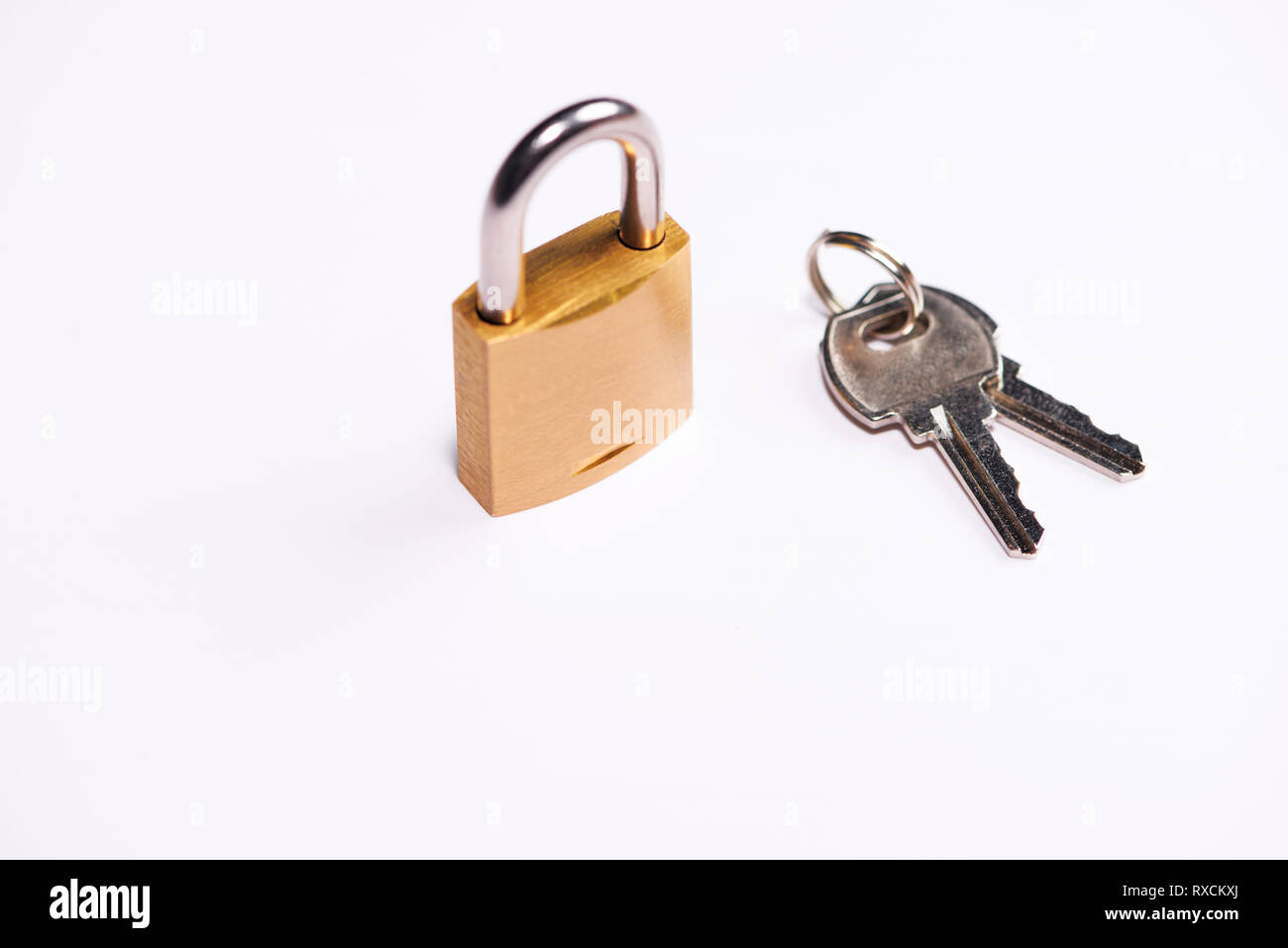Key lock locked with keys on table Stock Photo - Alamy