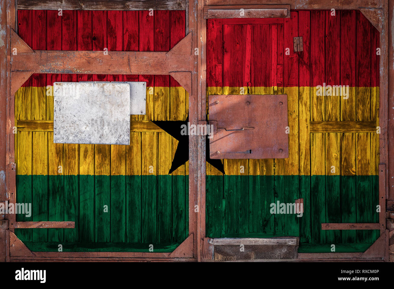 Close-up of old warehouse gate with national flag of Ghana. The concept ...