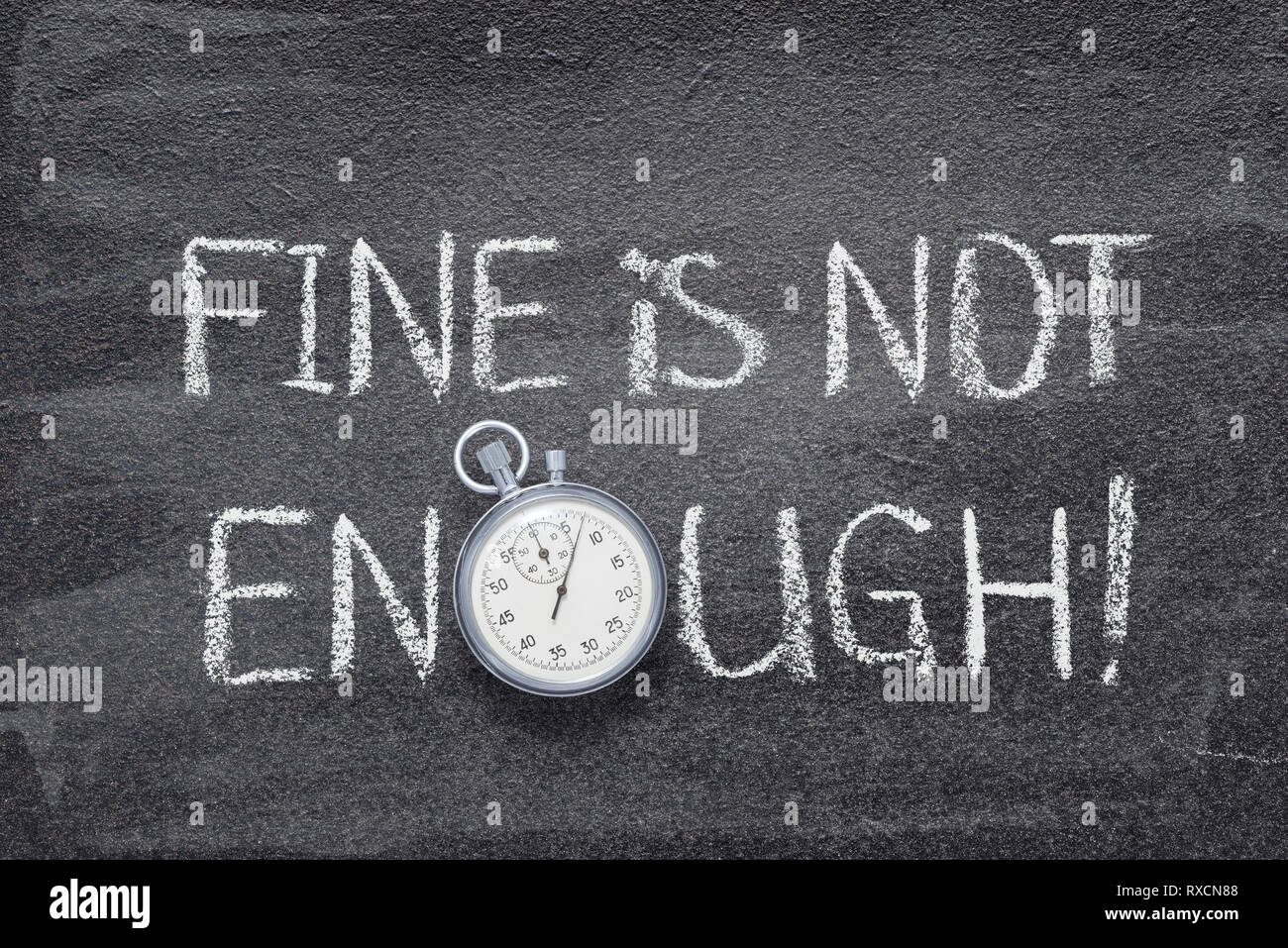 fine is not enough phrase handwritten on chalkboard with vintage ...