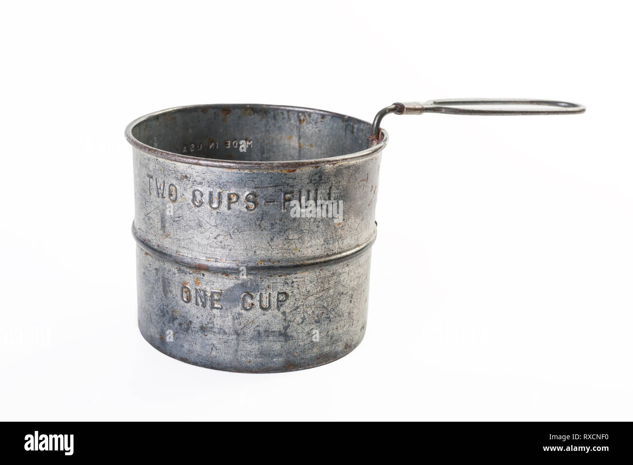 An old tin measured cup flour sifter Stock Photo - Alamy