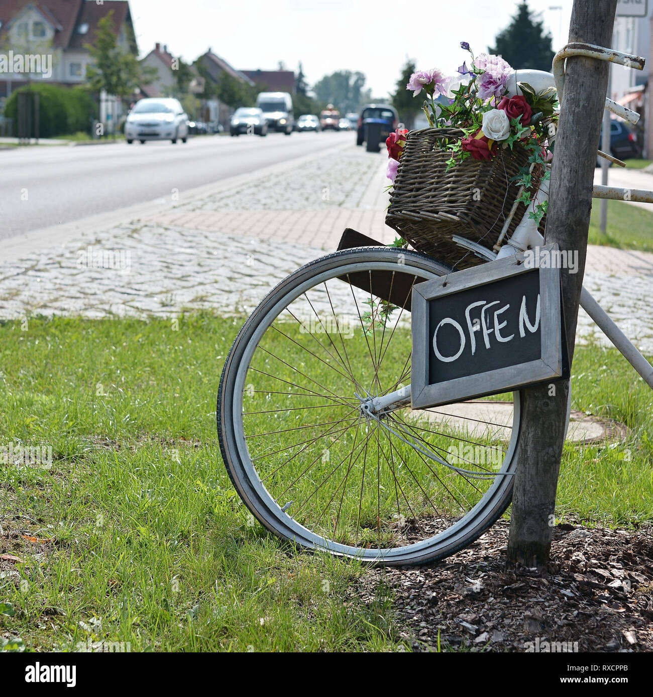 Advertising for a flower shop on the roadside Stock Photo - Alamy