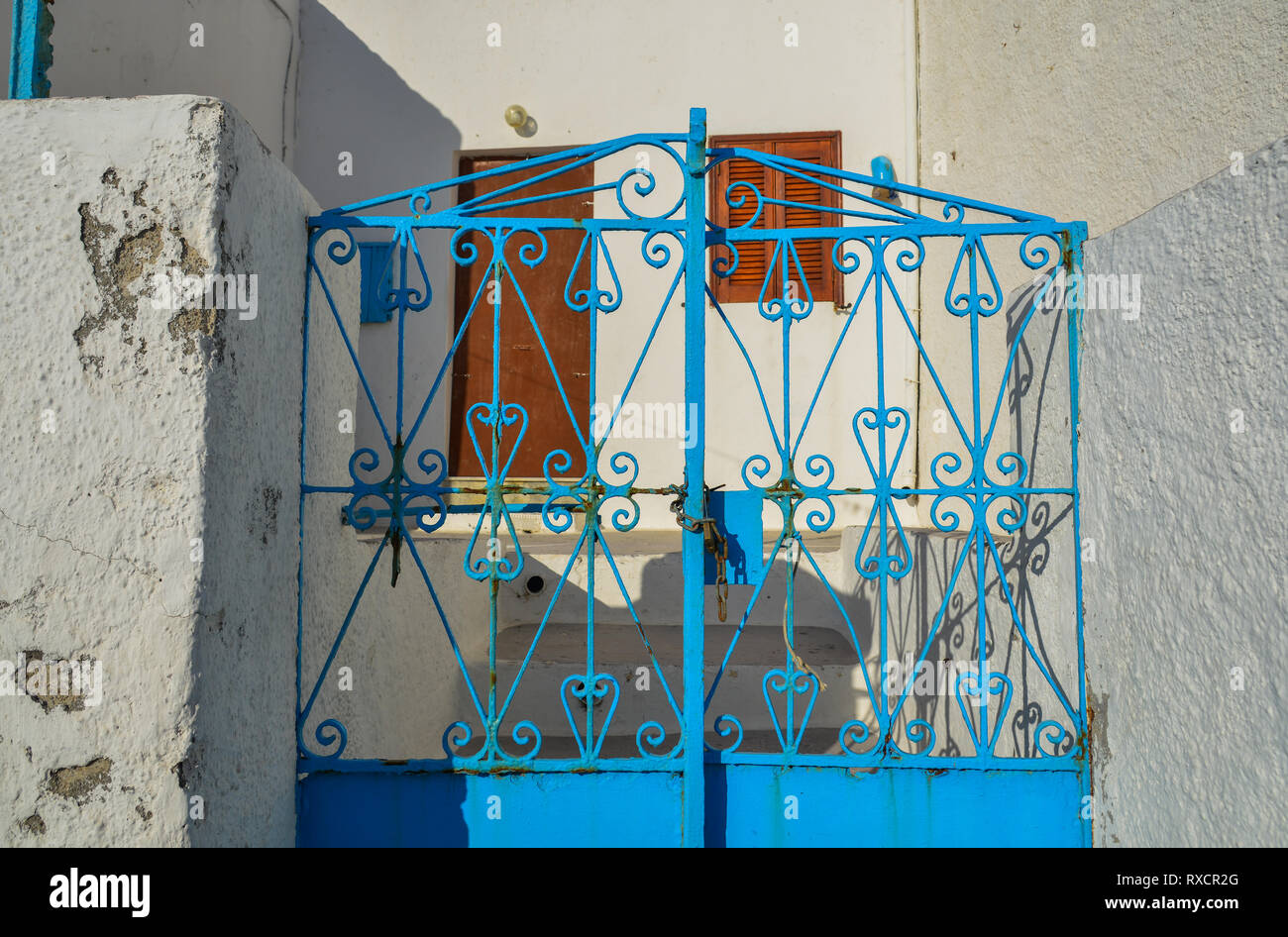 Old blue iron gate of a typical house on Santorini Island, Greece Stock ...