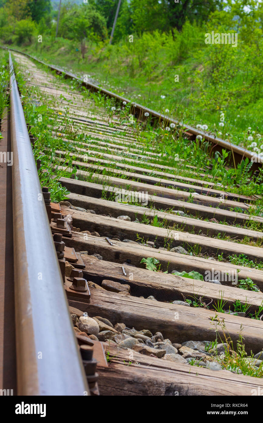 railway rails with wooden sleepers unusual perspective Stock Photo - Alamy