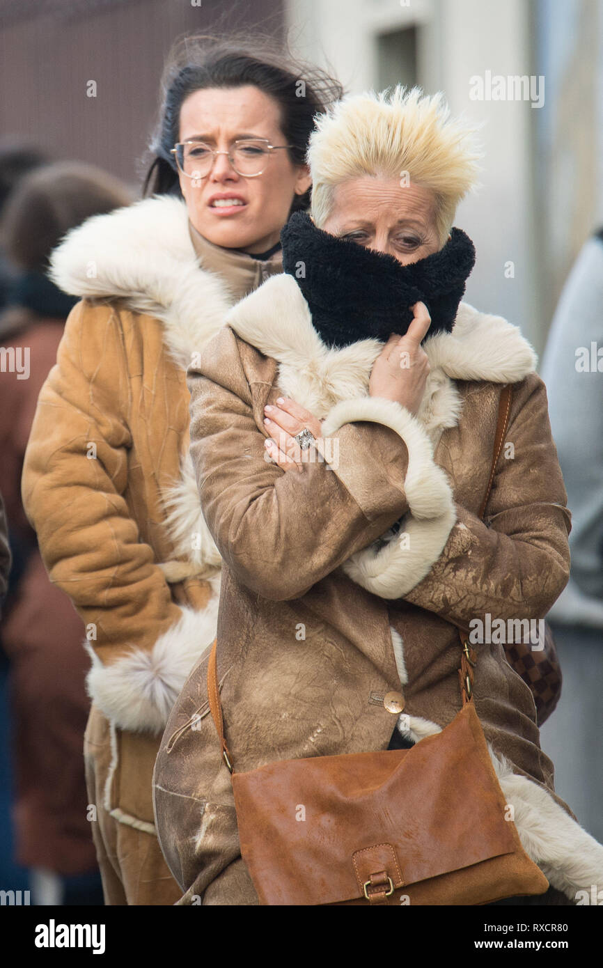 People are buffeted by strong winds while crossing Westminster Bridge ...