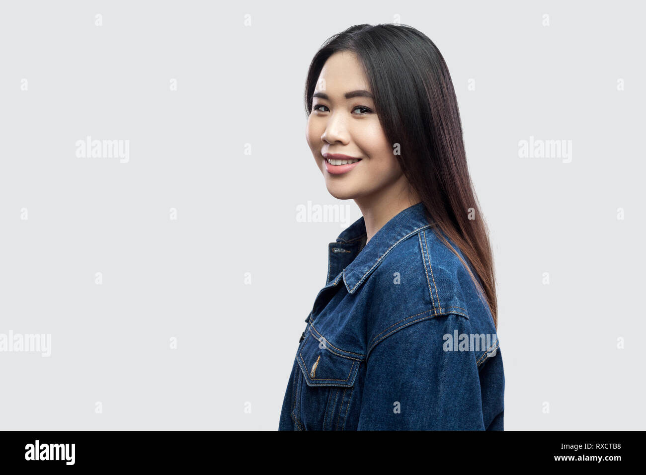 Profile side view portrait of happy beautiful brunette asian girl in ...