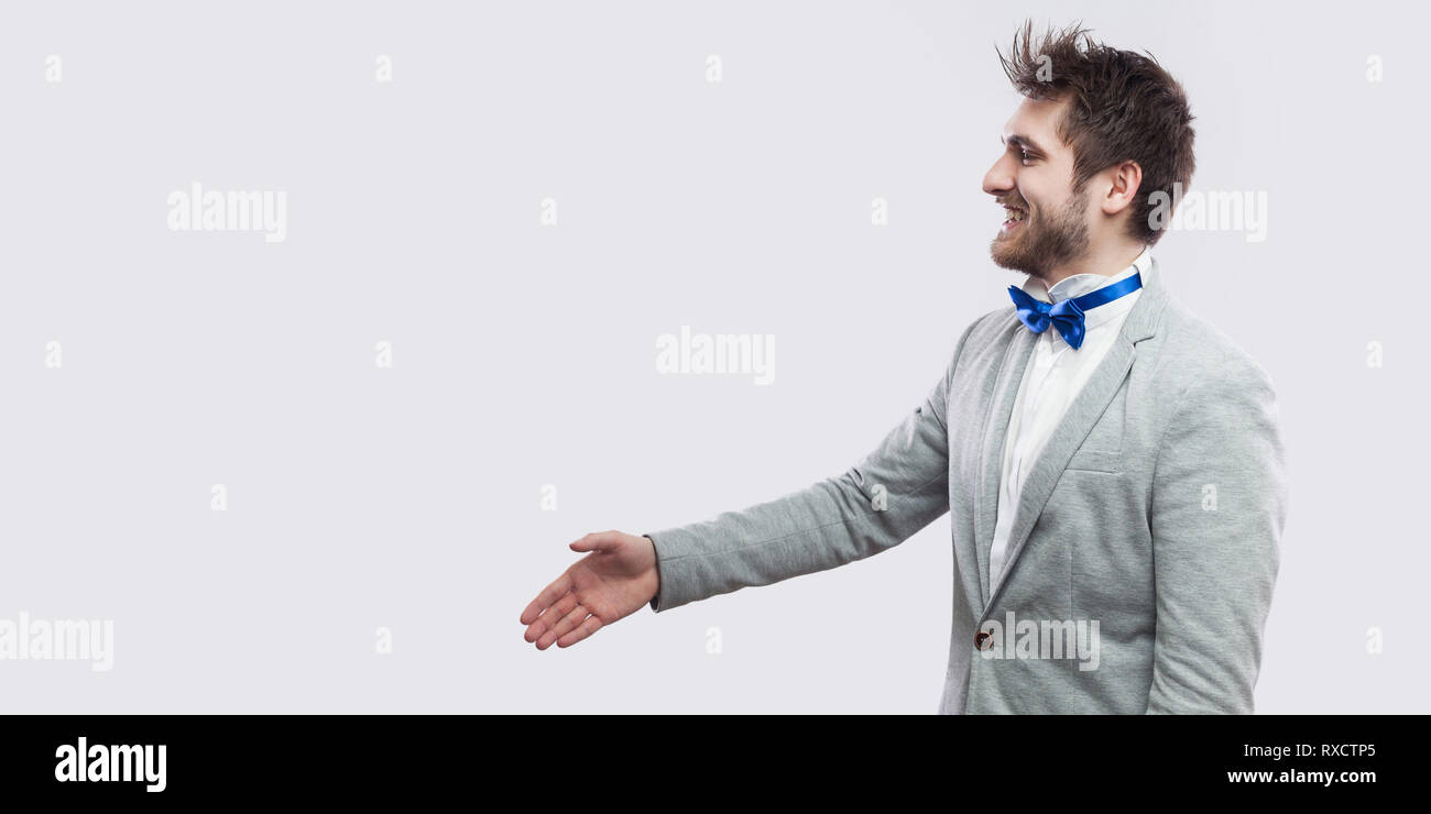 Profile Side View Portrait Of Happy Handsome Bearded Man In Casual Grey