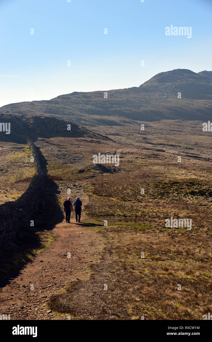 Two Hikers Walking from the Wainwright Birkhouse Moor to Striding Edge ...