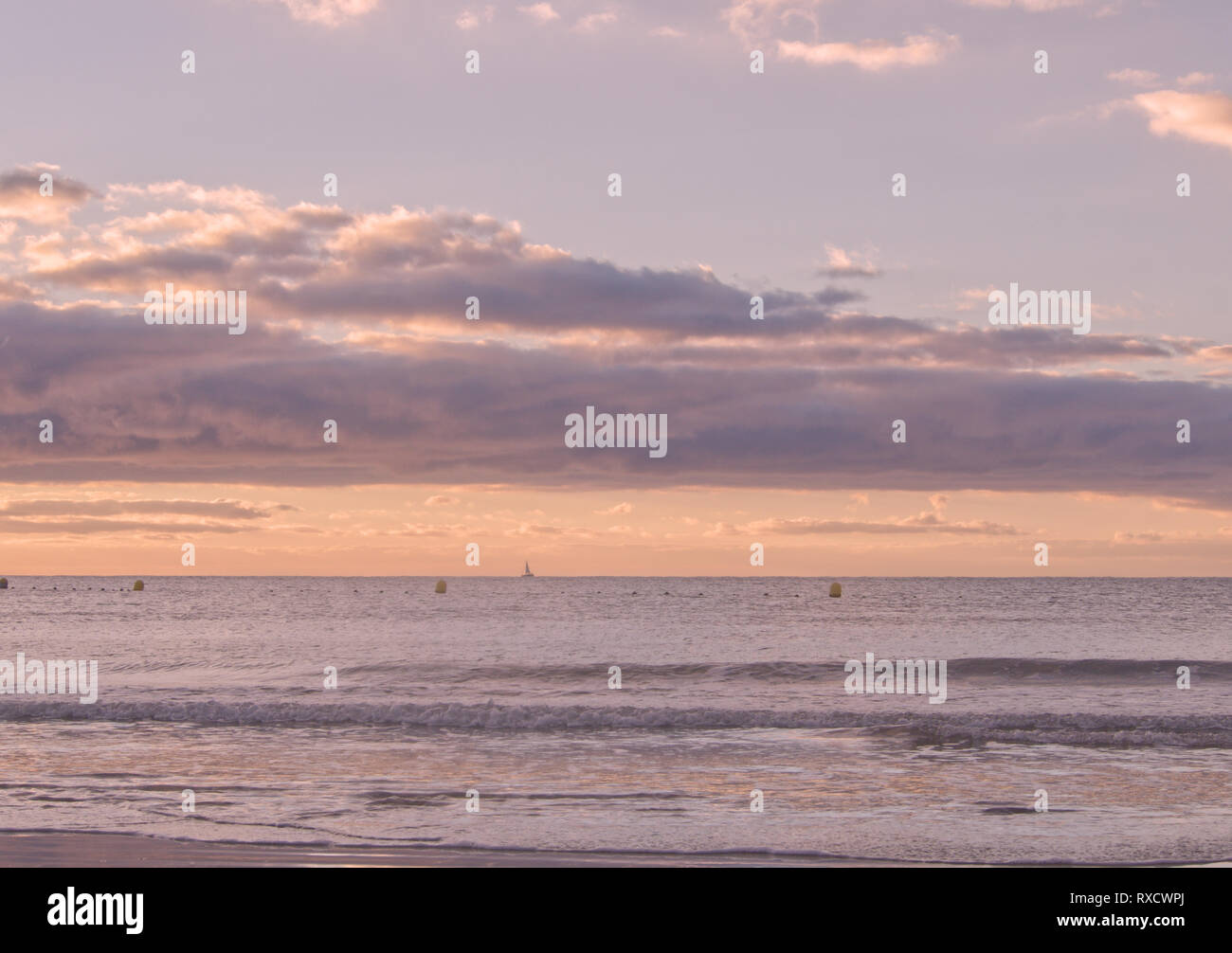 Seascape with fishing boats at sunrise Stock Photo - Alamy