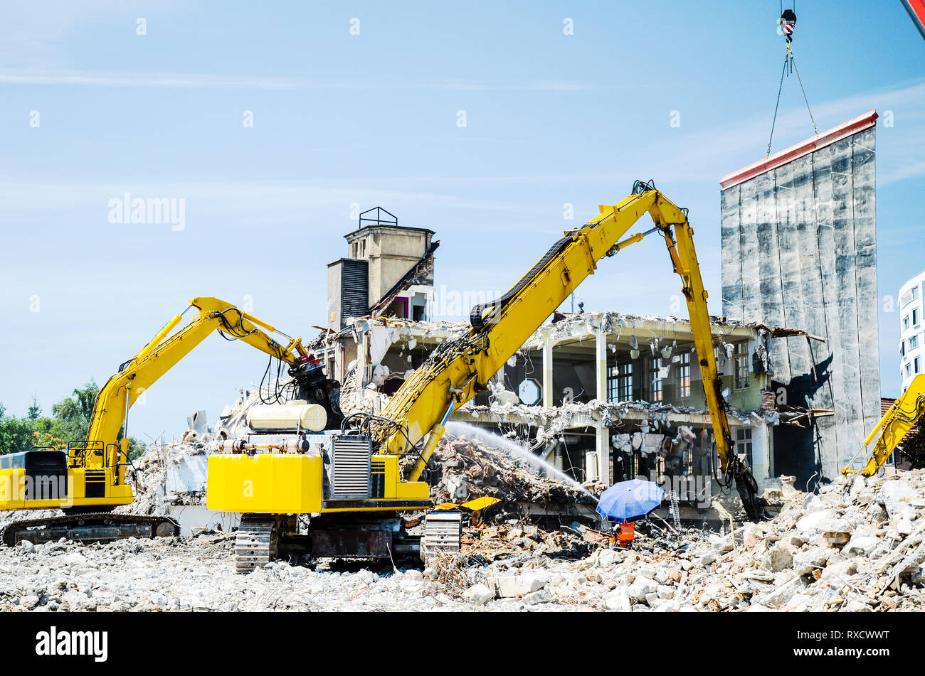 bulldozer crushing the building at construction site Stock Photo - Alamy