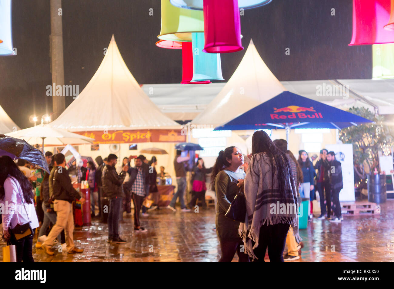 People roaming around shopping from open tents Stock Photo - Alamy