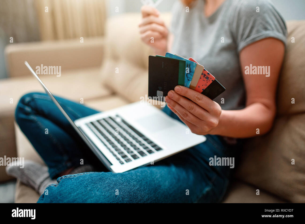 Online shopping at home. Hands are holding credit cards and using ...