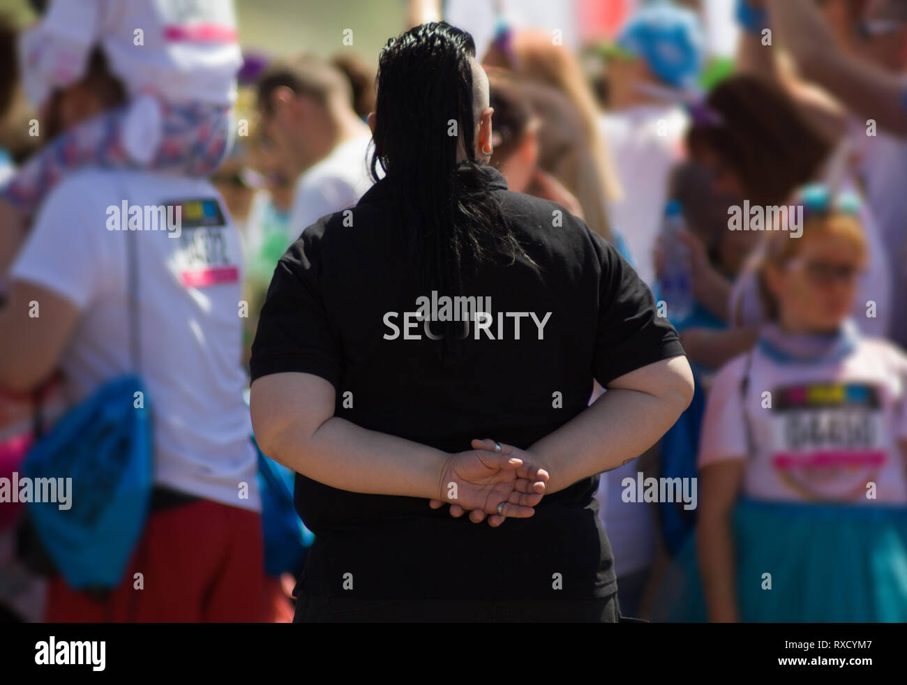 Member of security guard team on public event. The word "security" on ...