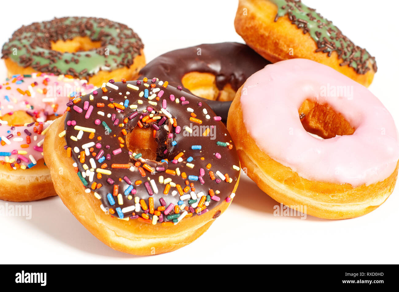 Colorful glazed donuts on white background. Pastries concept Stock ...