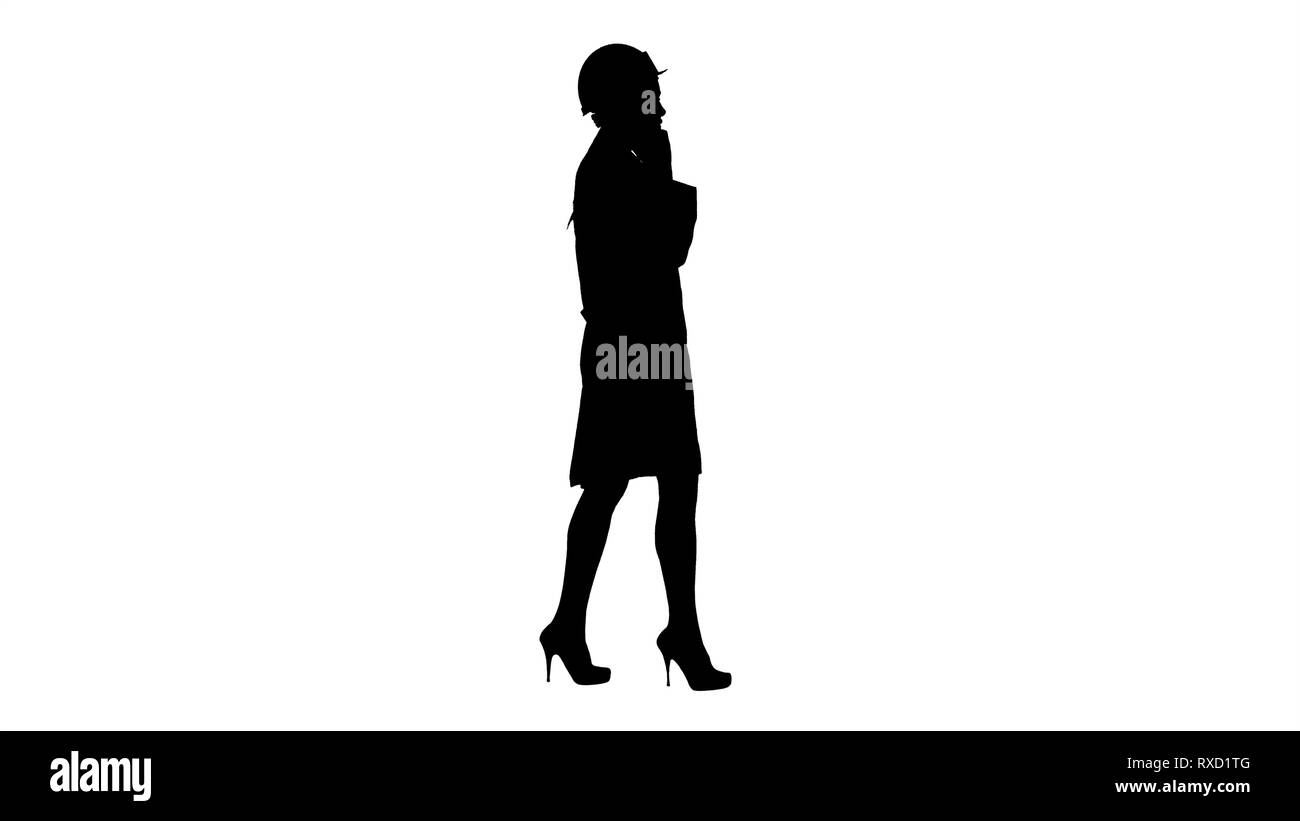 Silhouette Female science engineer making a call while walking Stock ...