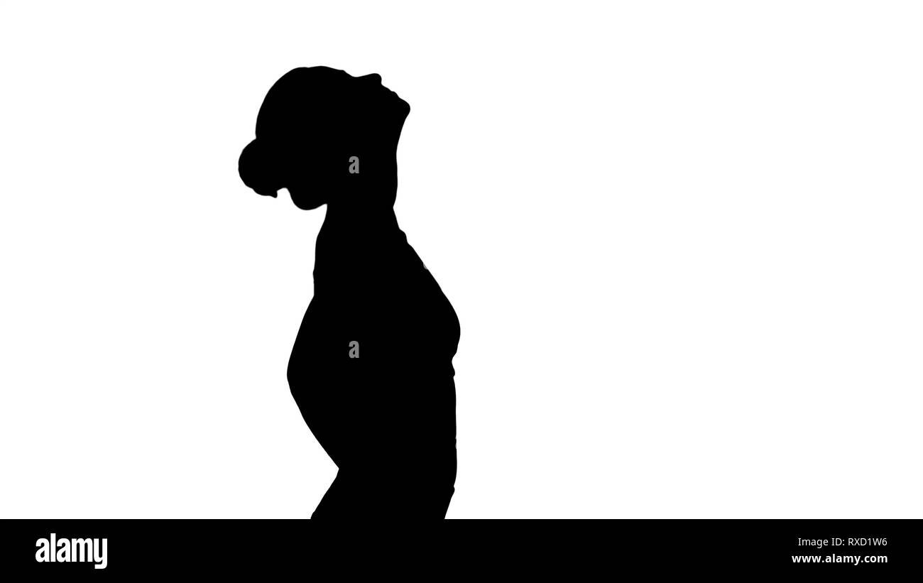 Silhouette Female walking and doing neck stretching exercise to release ...