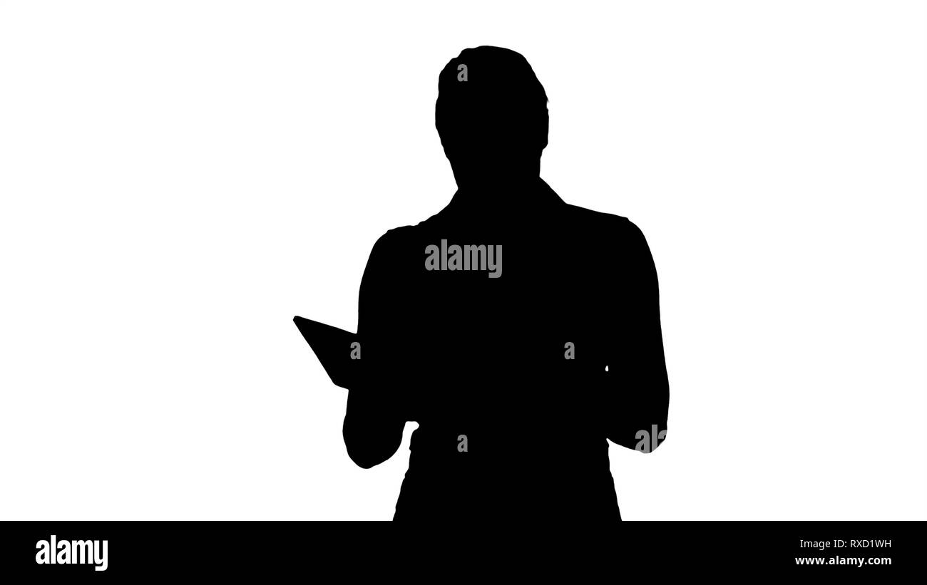 Silhouette Woman hold and open book or notebook reading something out ...