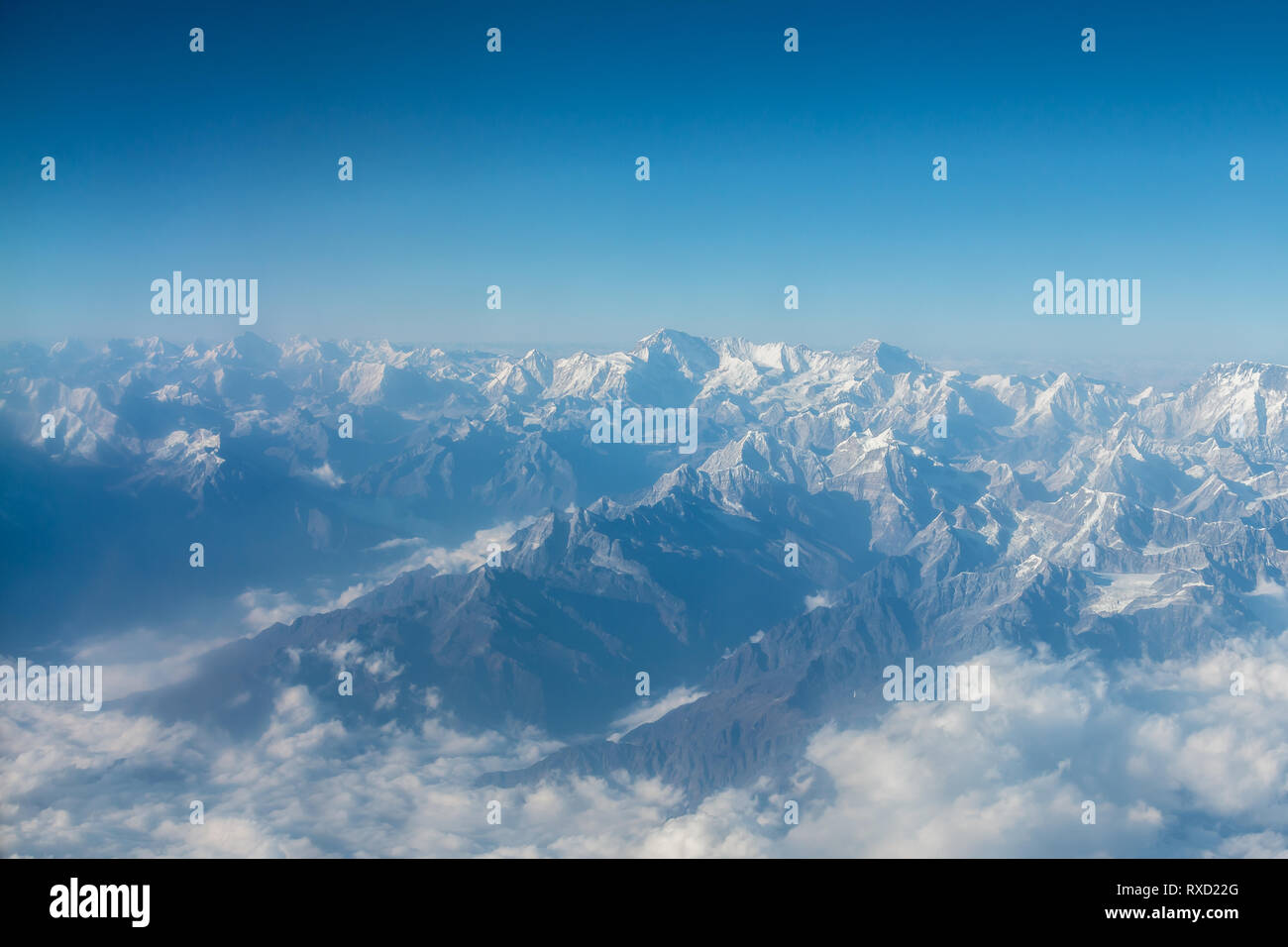 Aerial view of the Himalaya mountains, taken from the flight between ...