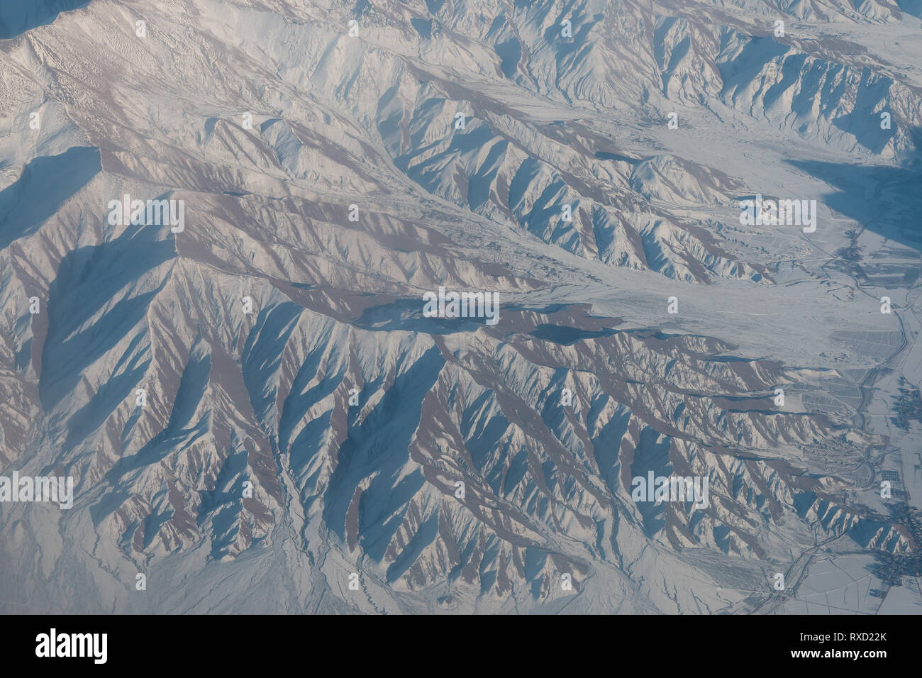 Aerial view of the Himalaya mountains, taken from the flight between ...