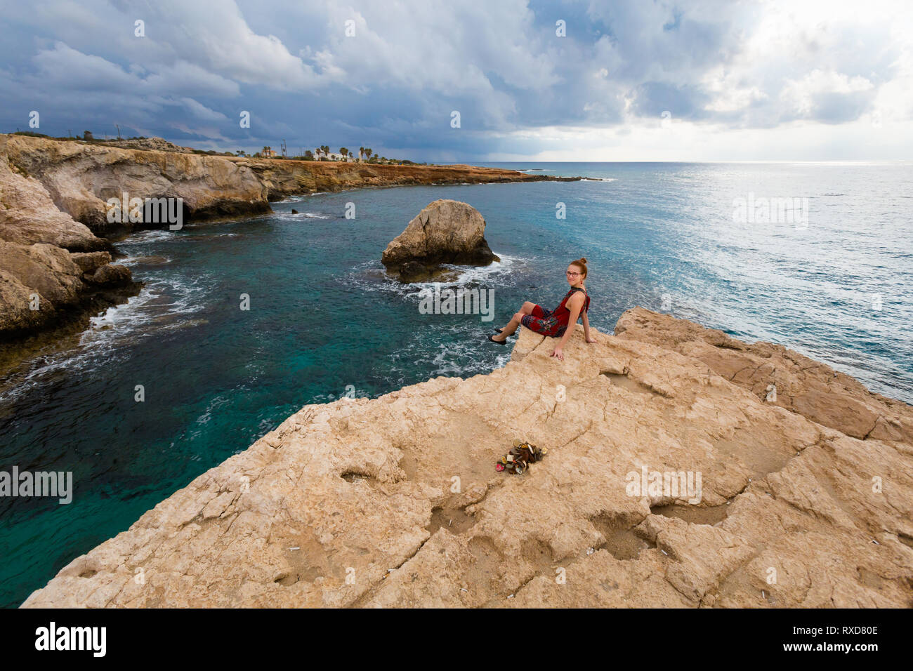 Tourist on beautiful Cape Greco monachus arch love bridge. Landscape ...