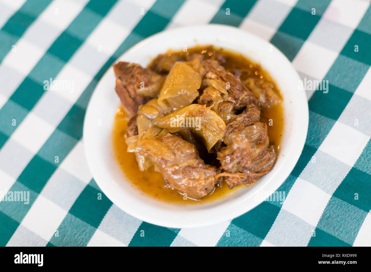 Beef and onion stew in local restaurant in Larnaca. Traditional cypriot ...