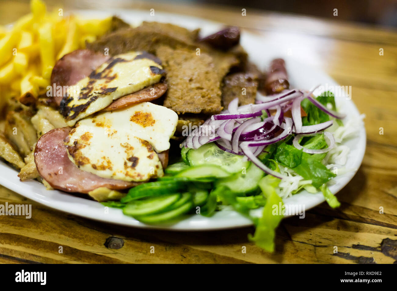 Mix kebab grill and halloumi with fries in local restaurant in Paphos ...