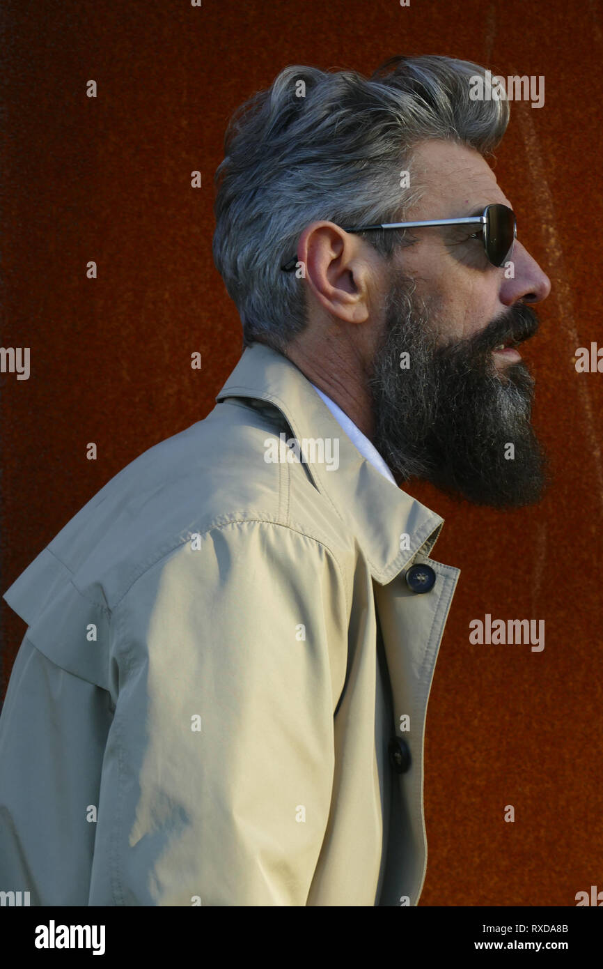 portrait of bearded man with raincoat and white shirt Stock Photo - Alamy